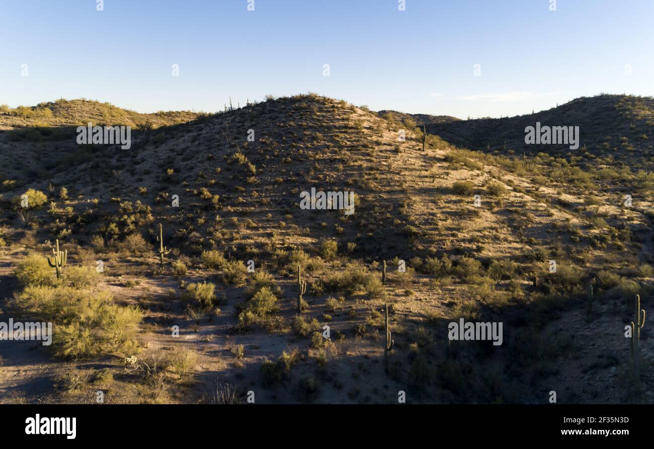 As the day comes to a close, the shadows grow long in the hills above ...