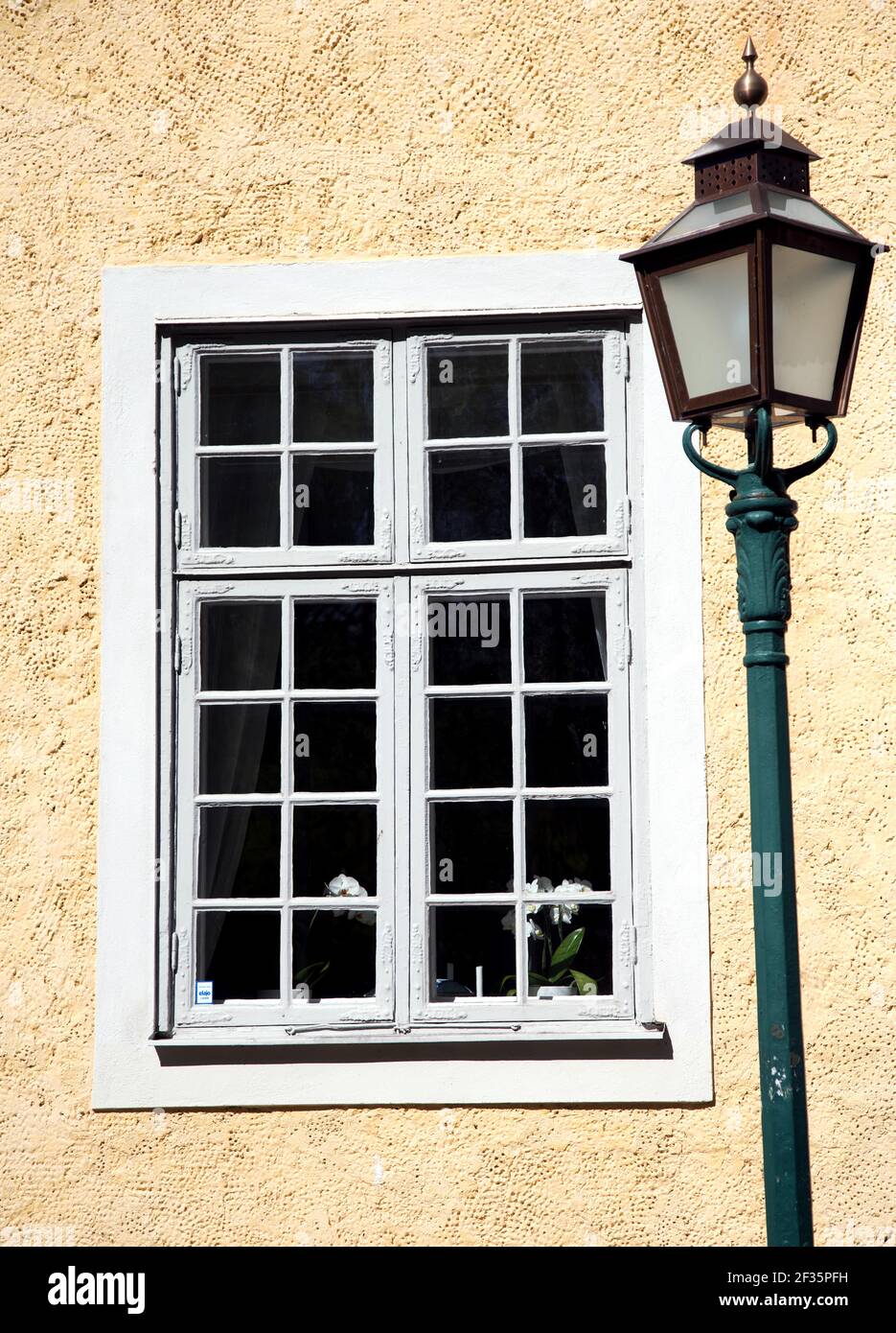 An old window with a street lamp Stock Photo - Alamy