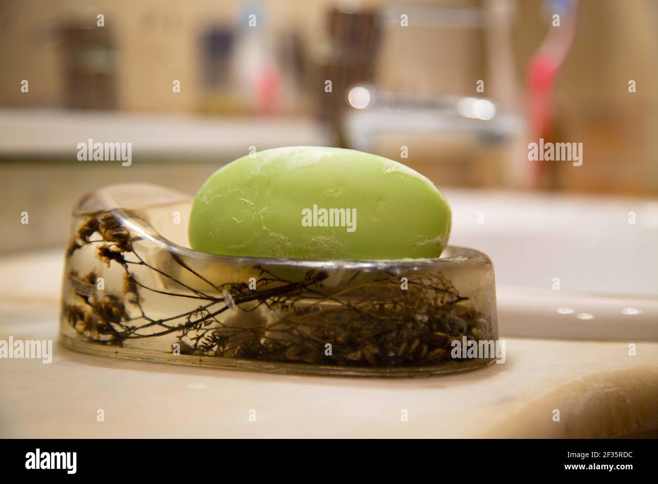 green soap, tap and white sink 2021 Stock Photo - Alamy