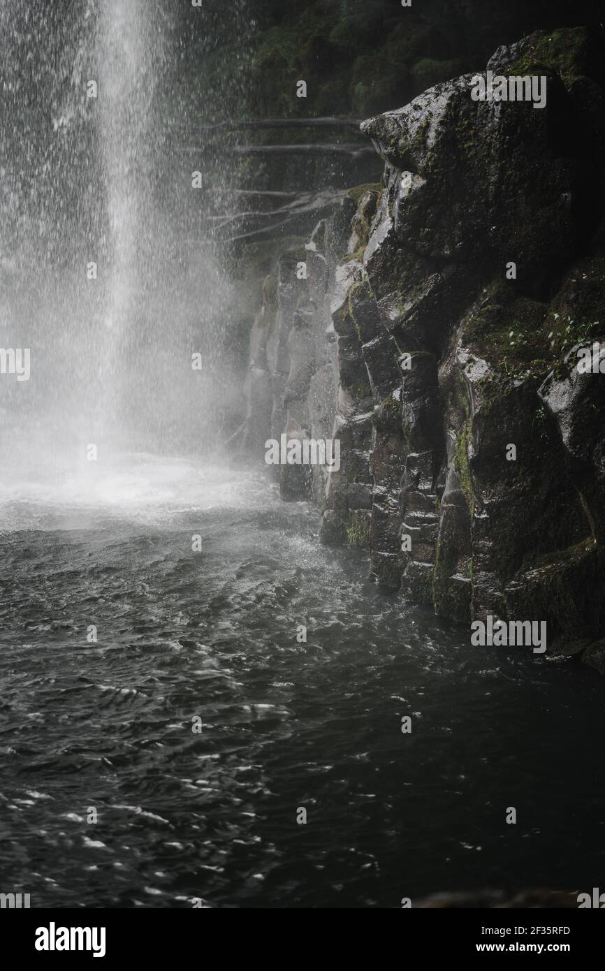 A vertical shot of an amazing waterfall in the forest Stock Photo - Alamy