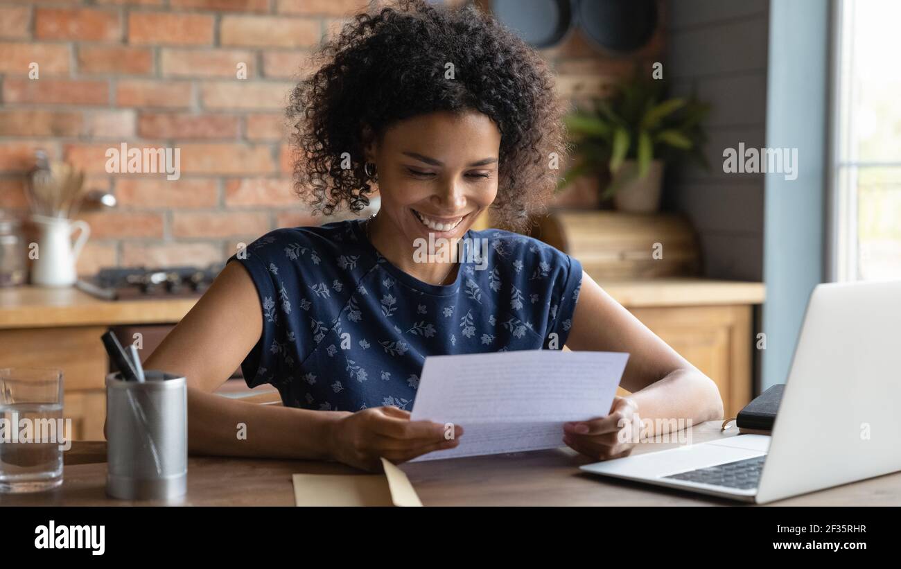 Happy young black female receive postal letter with good news Stock ...