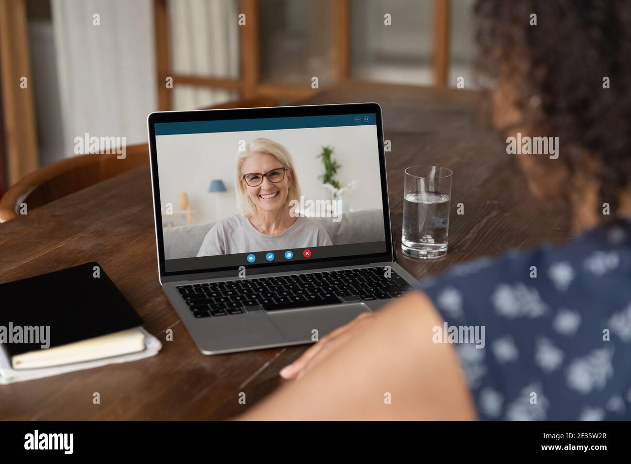 African female student having virtual meeting with old lady tutor Stock ...