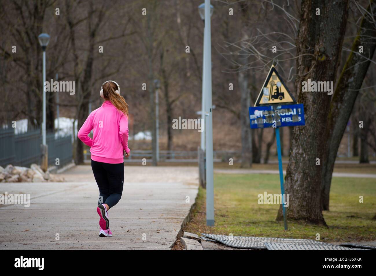 Blonde girl running park hi-res stock photography and images - Alamy