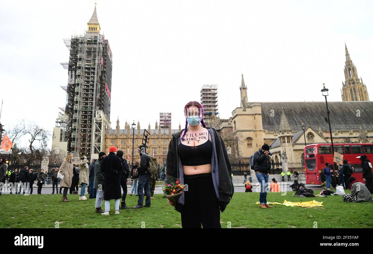A demonstrator ahead of a protest in Parliament Square, central London ...
