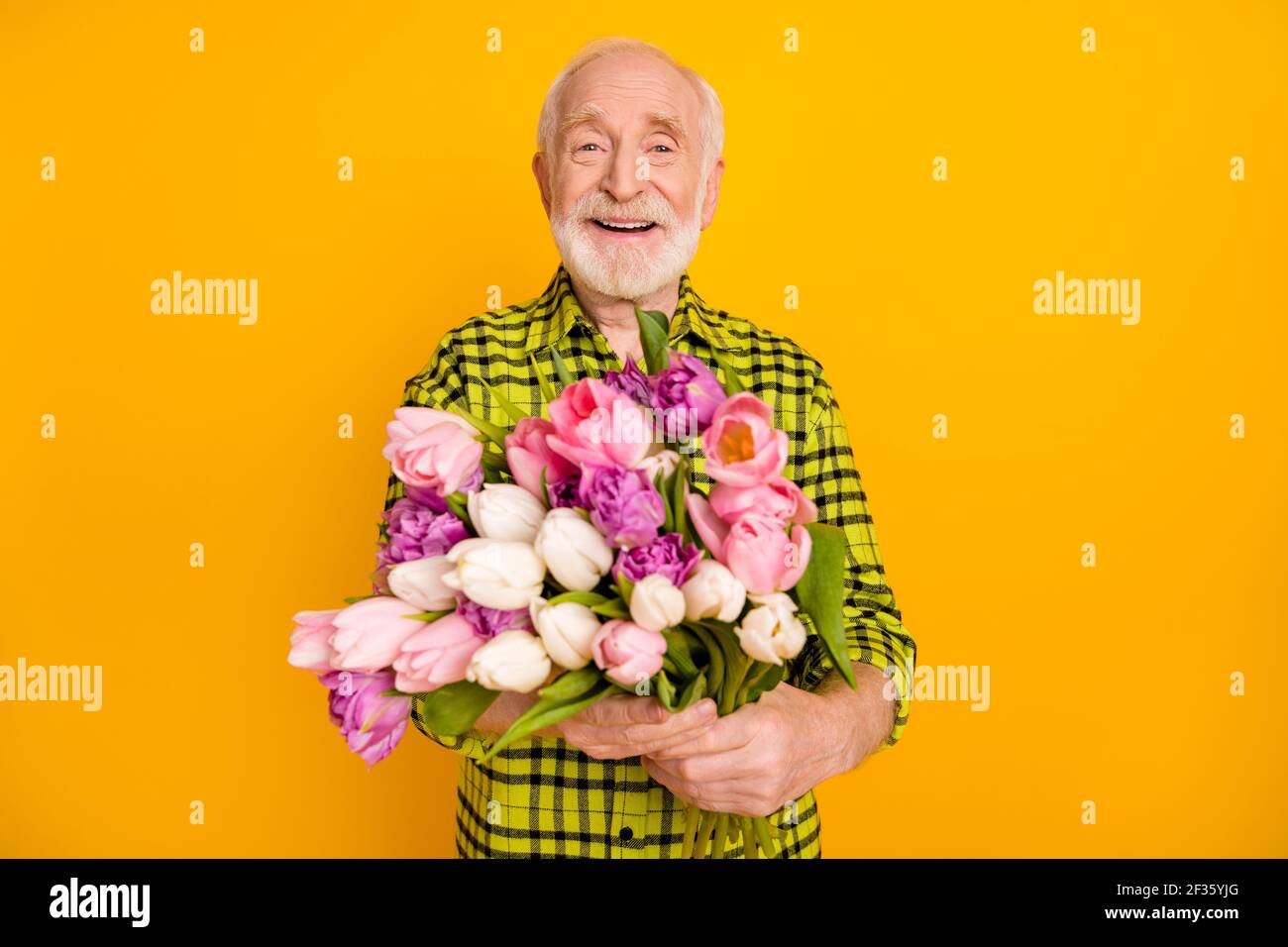 Photo of senior man hold bunch flowers smile wear checkered green shirt ...