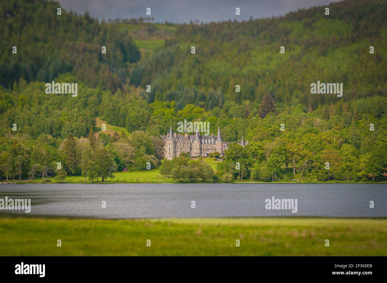 Tilt shift effect of ancient manor of Mor Trossachs, facing Loch Achray ...