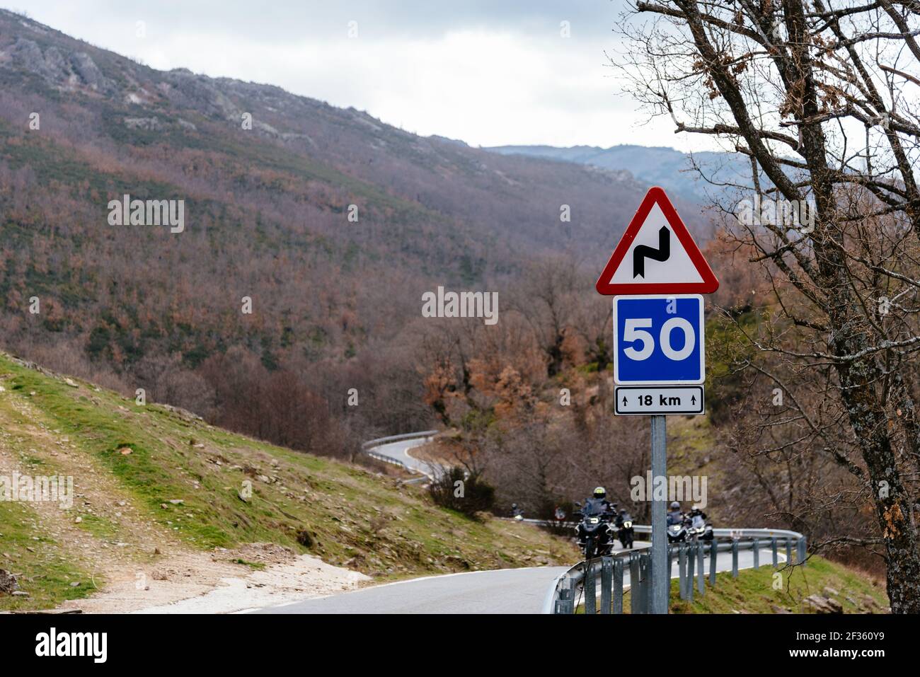 Traffic Signs in Mountain Road. Safety Concept. Dangerous curves ahead ...