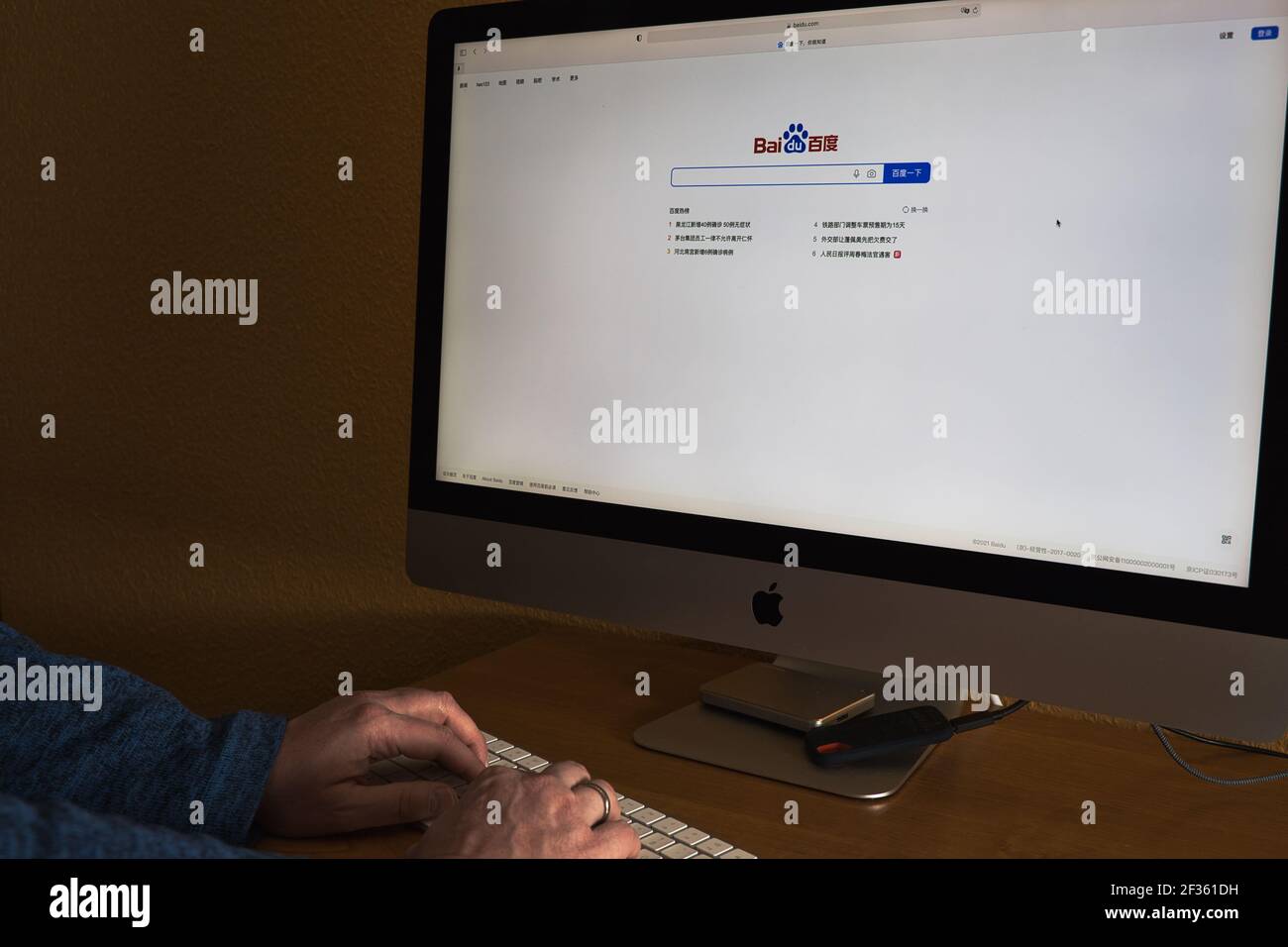 OLDENBURG, GERMANY - Jan 13, 2021: male hands on a keyboard using the ...