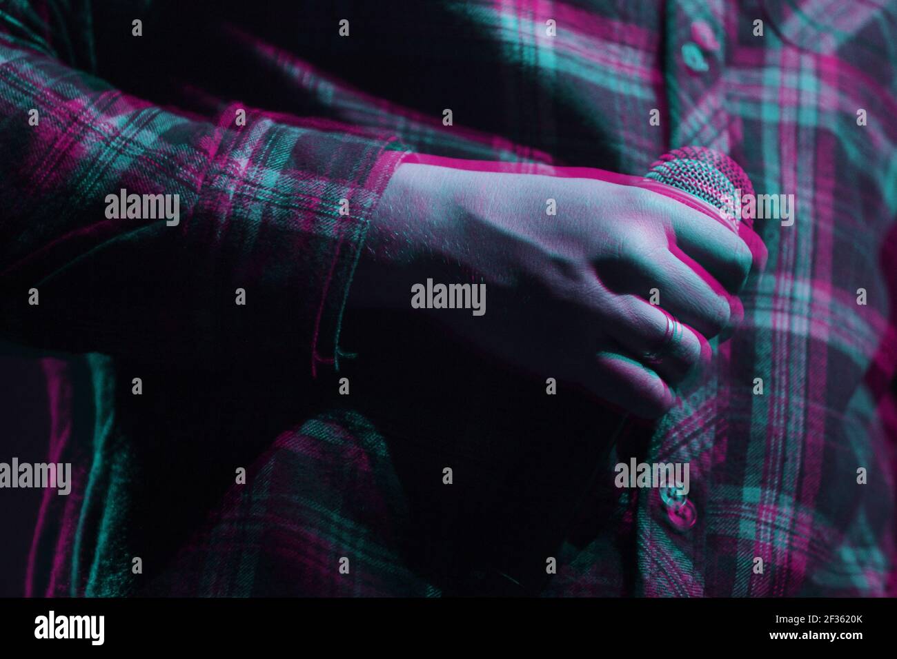 Rap singer holding microphone in hand edited with retro 3d stereo ...