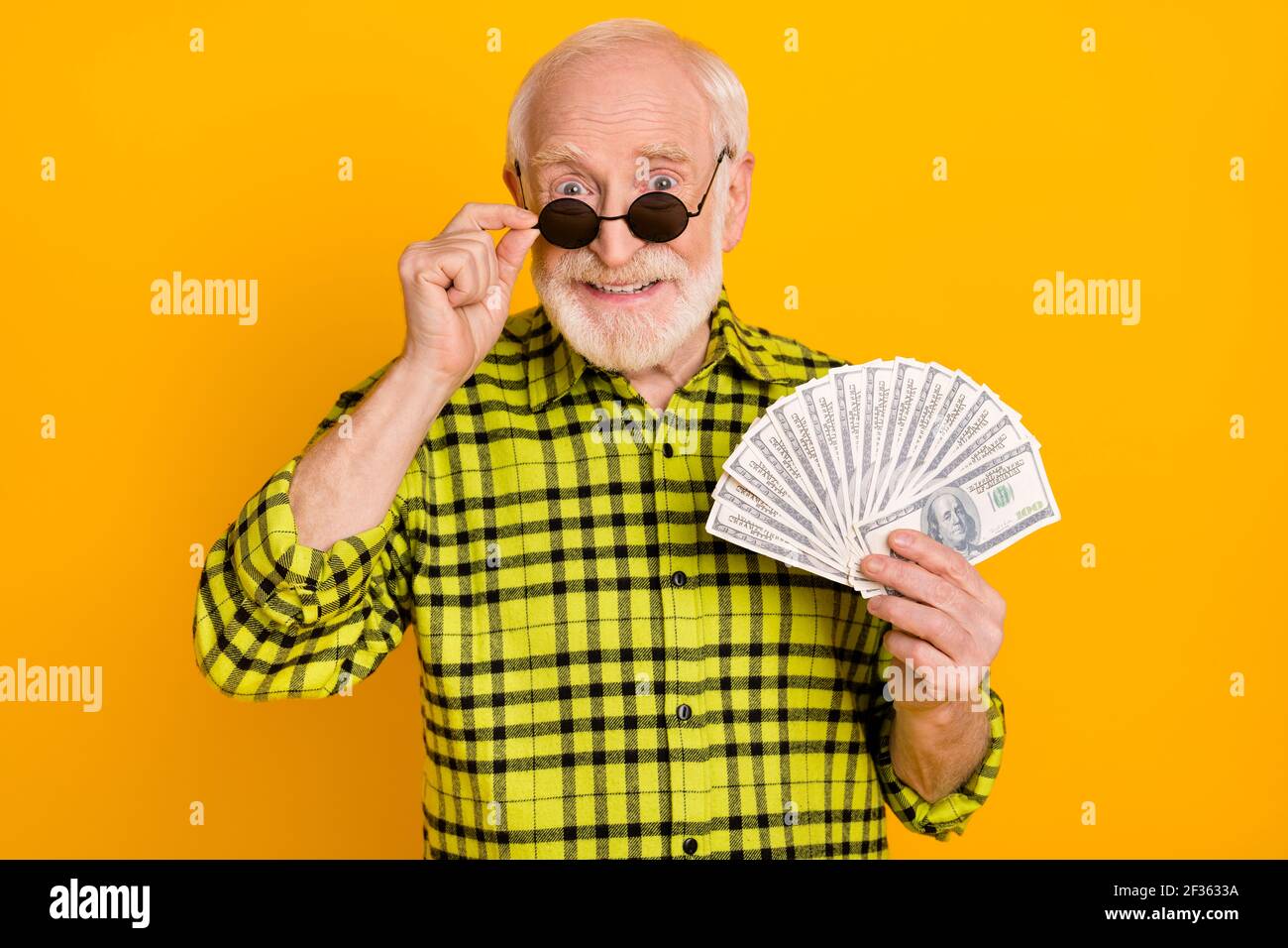 Photo of aged man happy positive smile hold money cash dollars ...