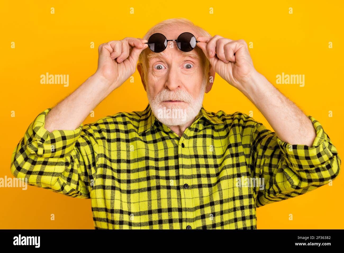 Photo of aged man amazed shocked surprised fake novelty news hands ...