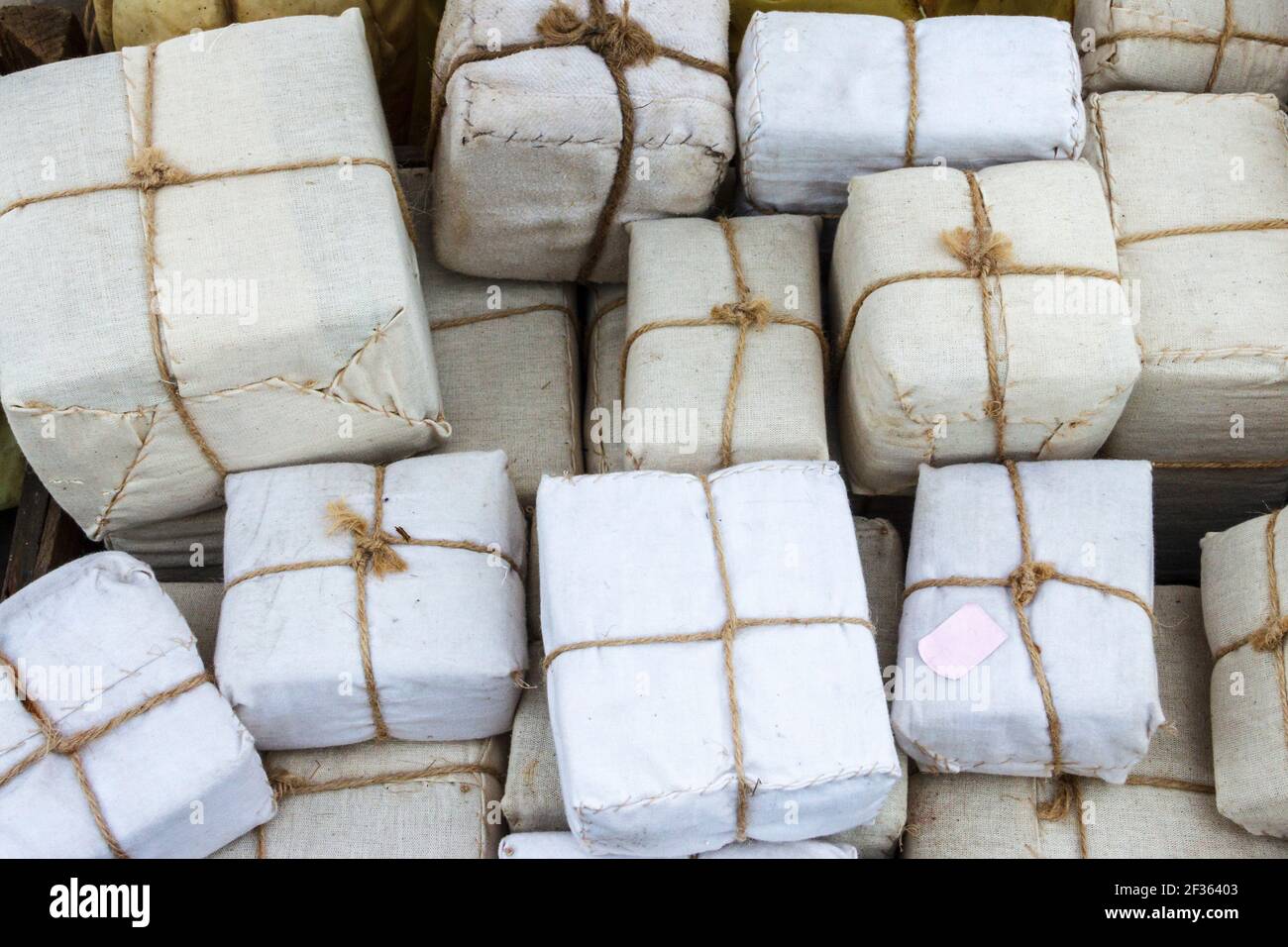 Produce wrapped in cloth tied with string in a Victorian-themed market ...