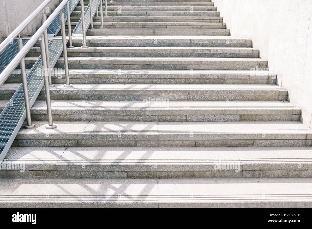 Outdoor staircase and wheelchair ramp. Urban interior. Gray staircase ...