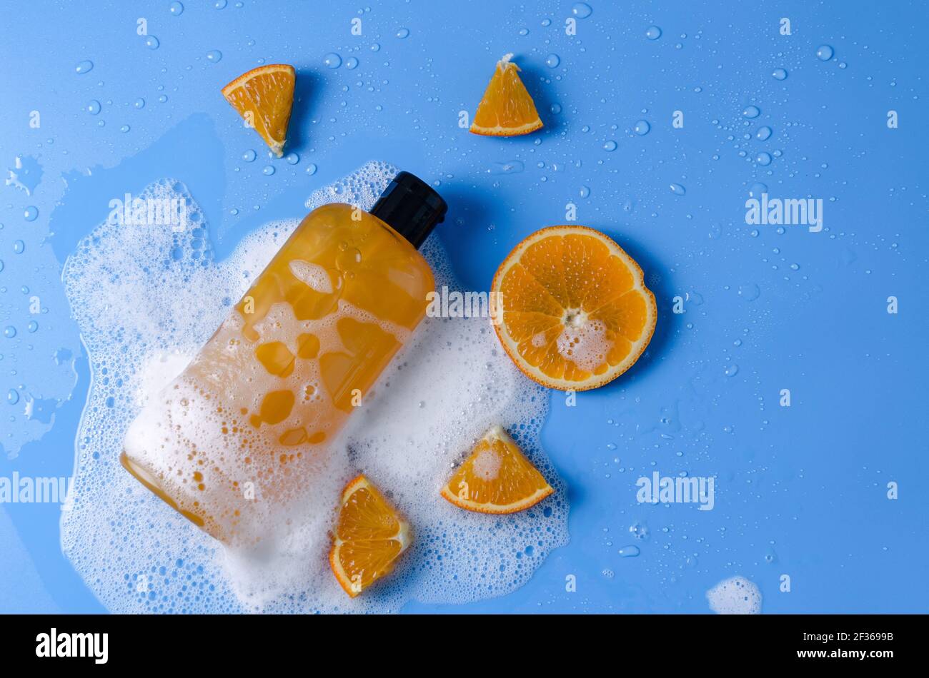 Shampoo, gel, liquid soap of orange color from natural ingredients in a ...