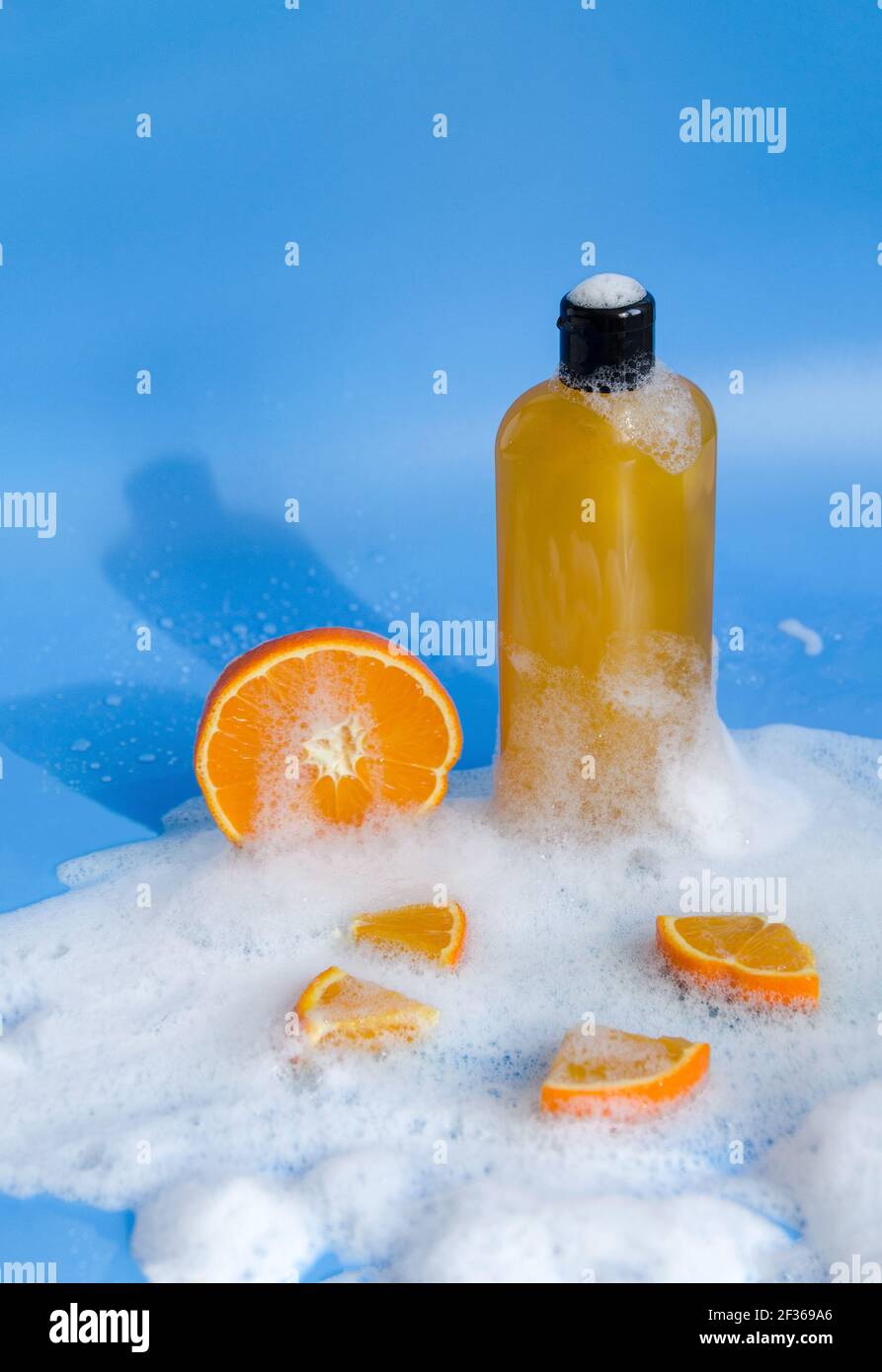 Shampoo, gel, liquid soap of orange color from natural ingredients in a ...