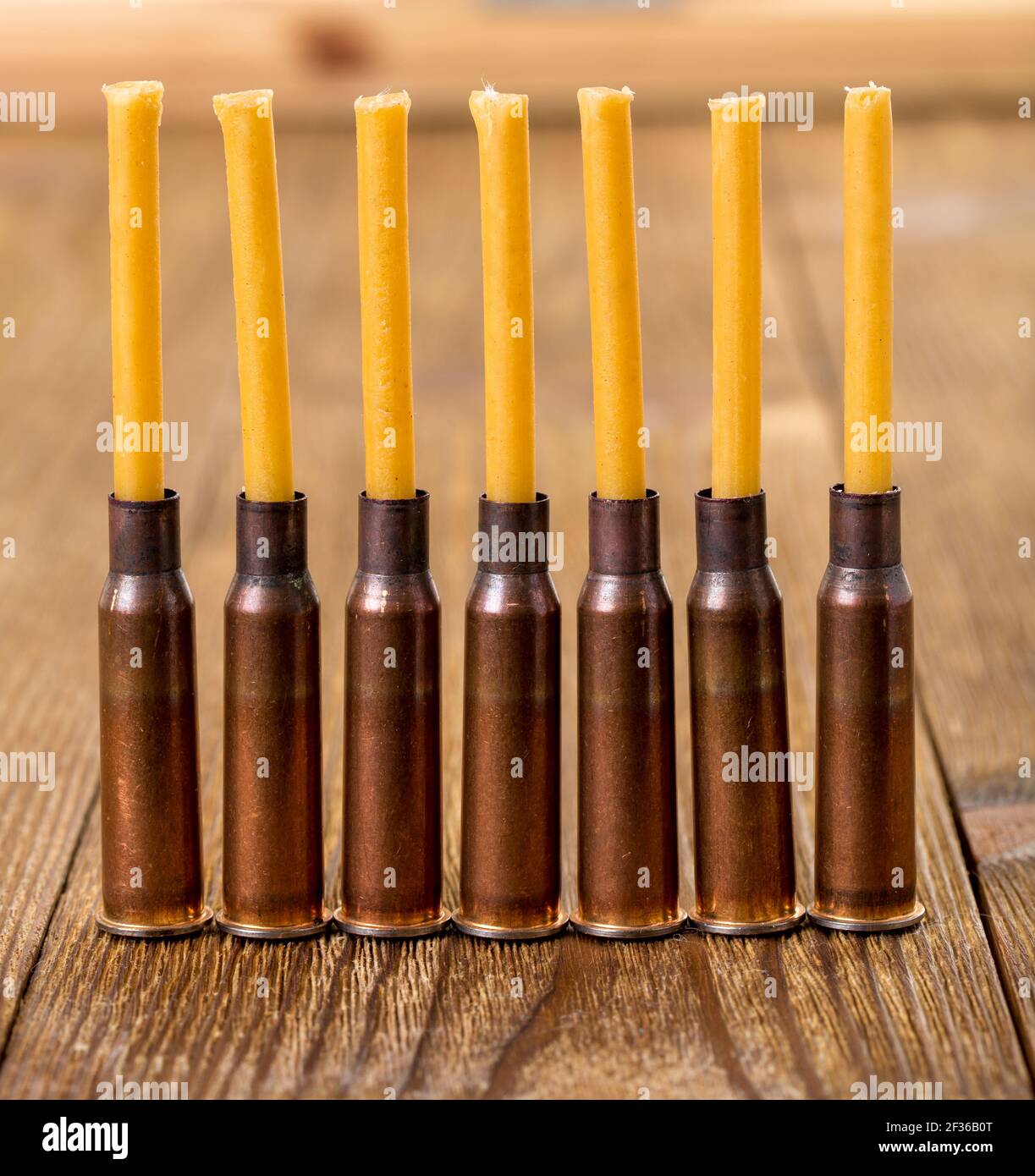 Candles and empty rifle cartridges. As a symbol of war and victims ...