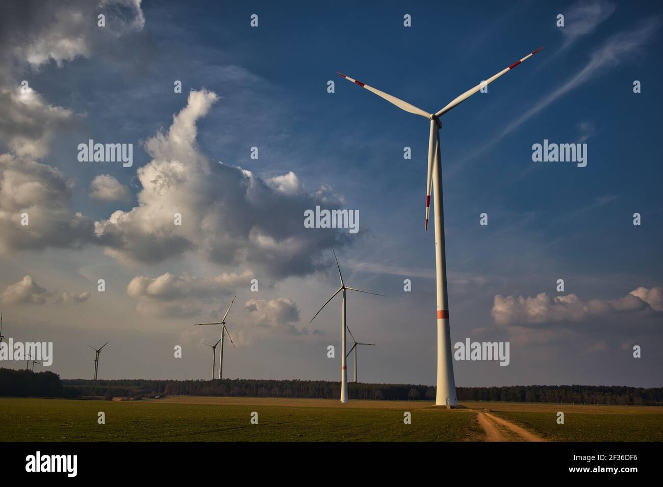 Wind turbines in Brandenburg Germany, blue sky Stock Photo - Alamy