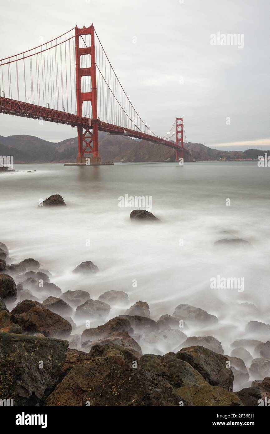 A long exposure from down below The Golden Gate Bridge Stock Photo - Alamy