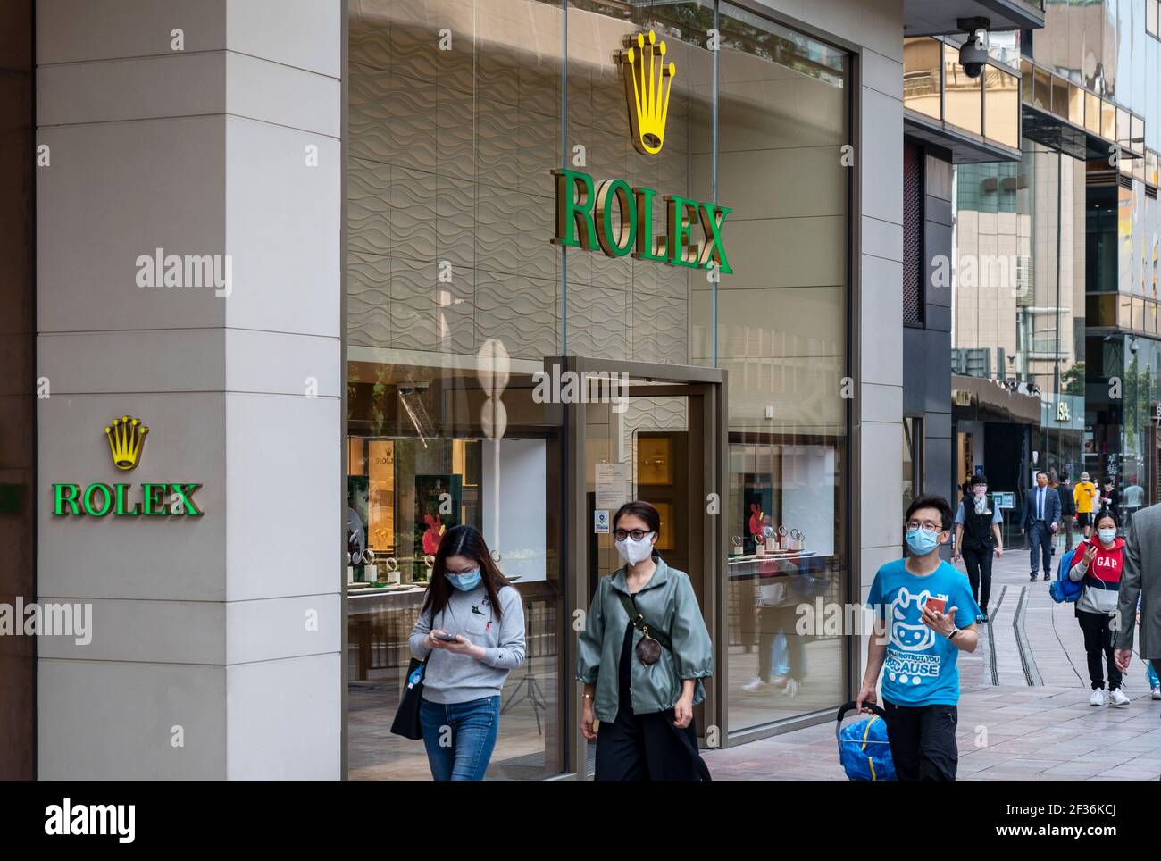 Pedestrians wearing face masks seen in front of the Swiss luxury ...