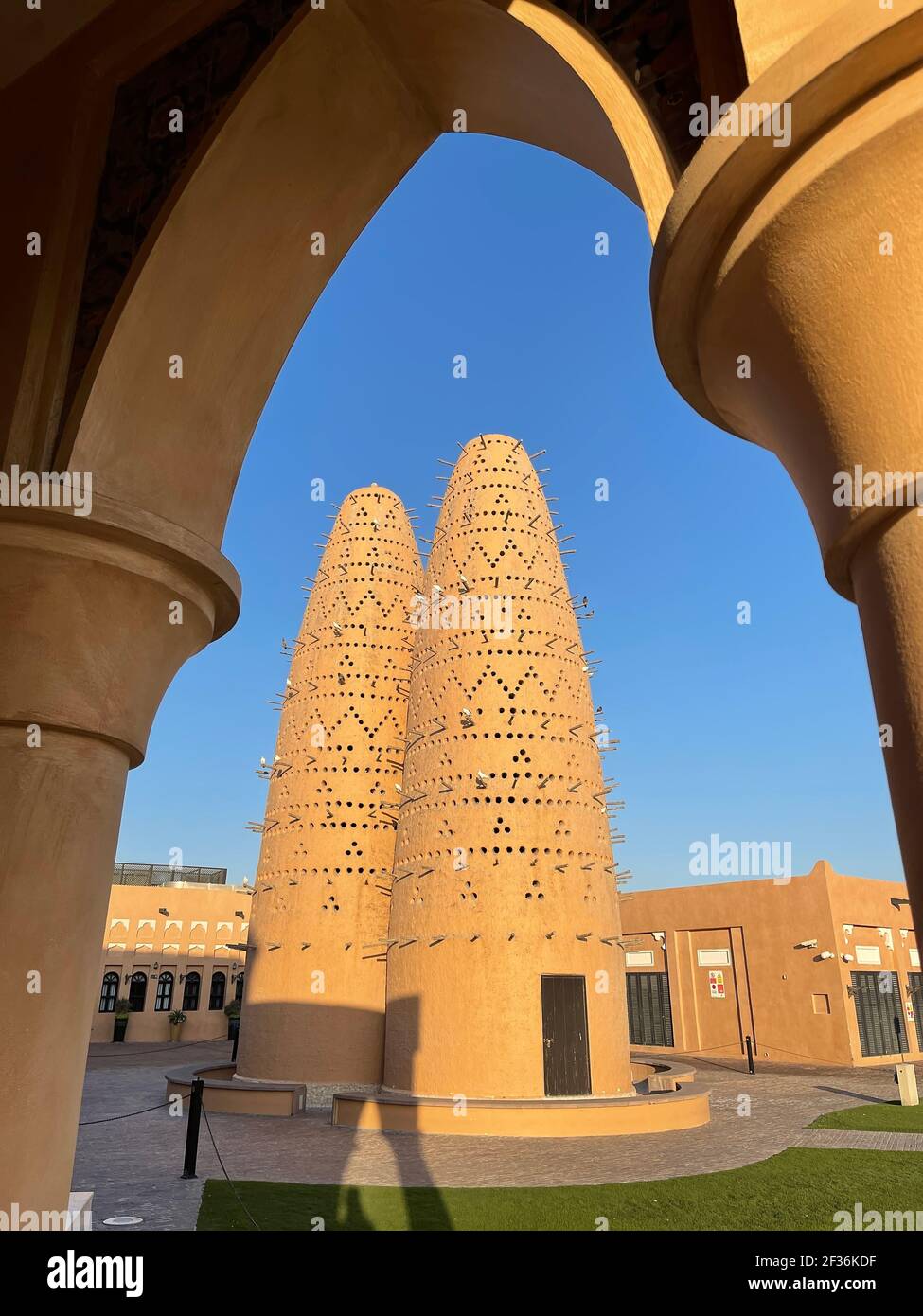 Traditional Qatari pigeon towers at the Katara Cultural Village in Doha ...