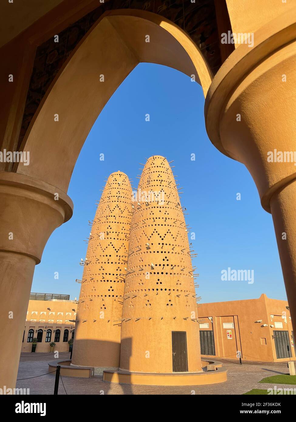 Traditional Qatari pigeon towers at the Katara Cultural Village in Doha ...