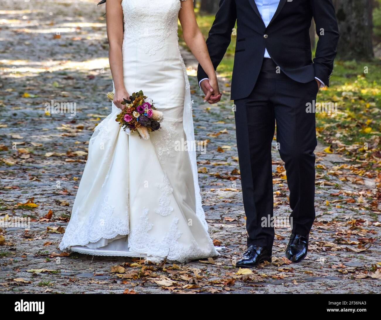 A romantic newly married couple in the garden, romance wedding day, no ...