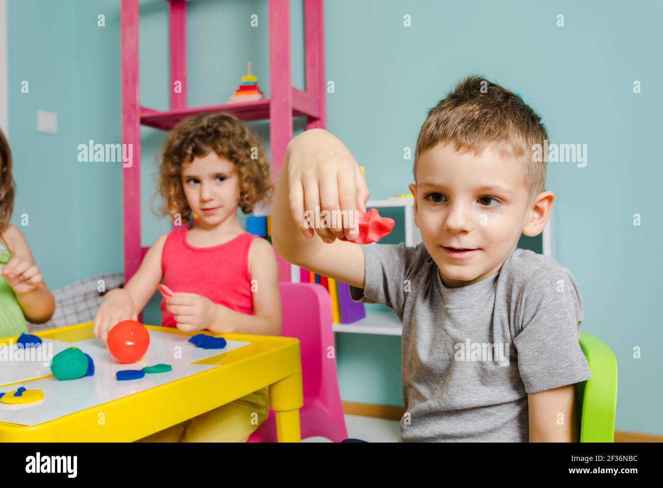 the child enjoys his work at the kindergarten Stock Photo - Alamy