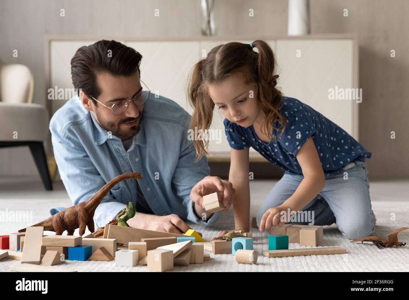 Caring dad have fun playing with daughter Stock Photo - Alamy