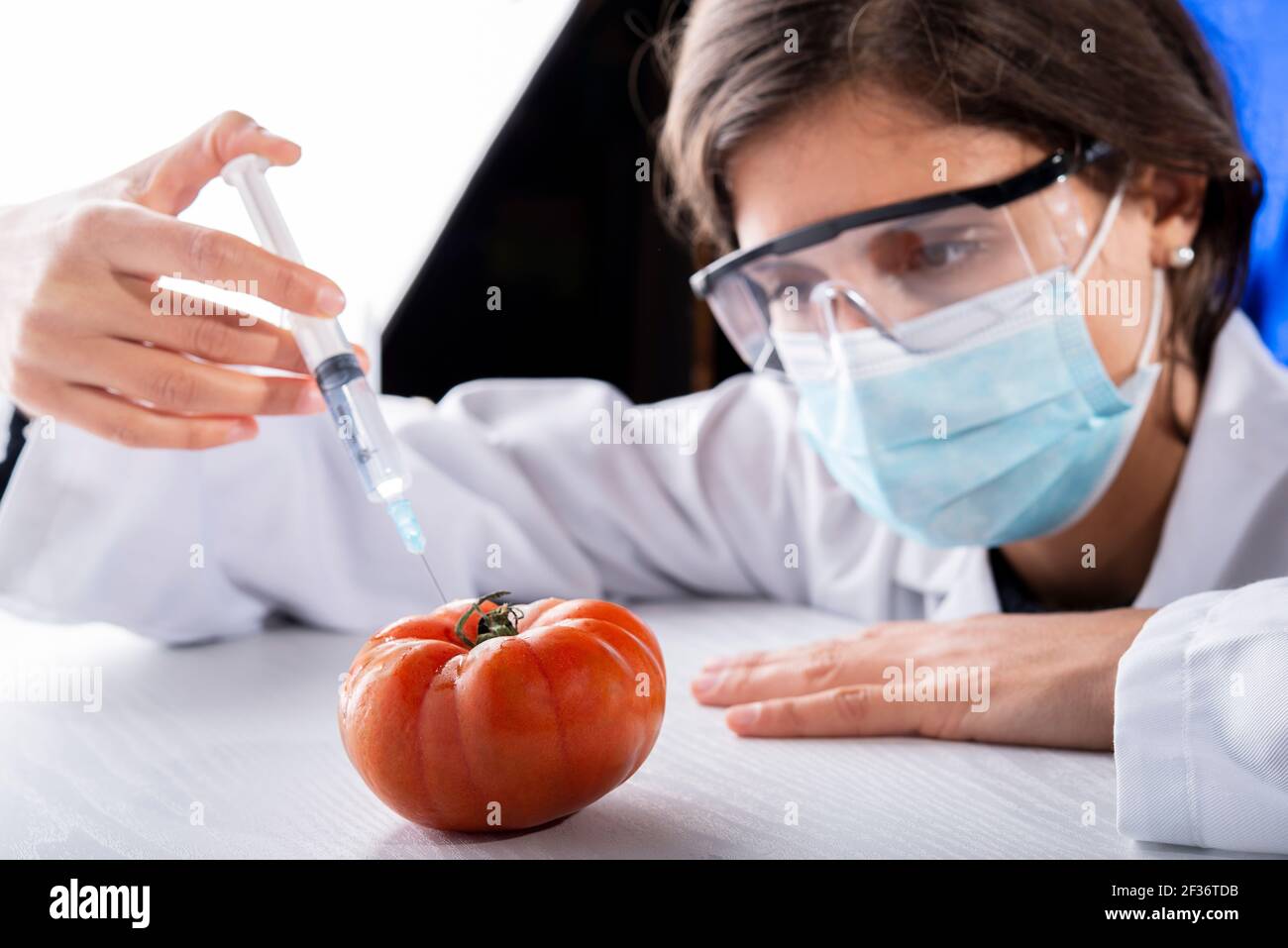 biologist woman researcher or scientist using laboratory injects the ...