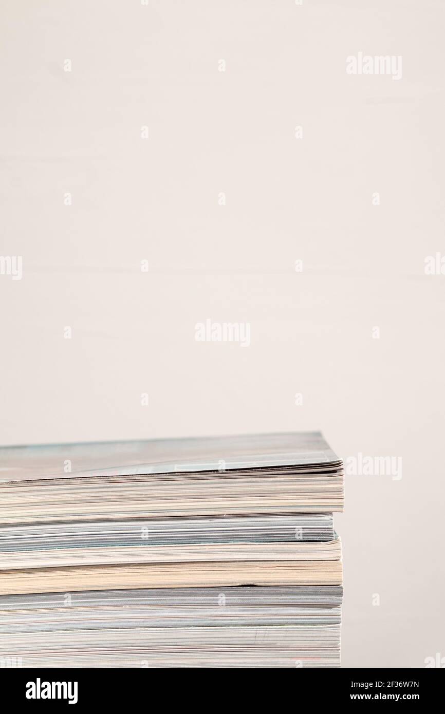 stack of magazines against white background, empty space for text Stock ...