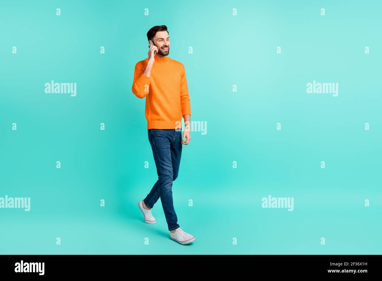 Full size profile side photo of young cheerful smiling man go walk ...