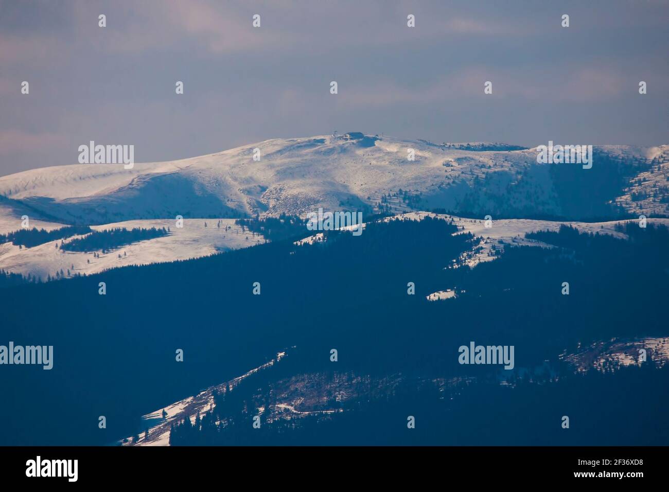 Budacu mountain with ski resort on top. Romania Stock Photo - Alamy