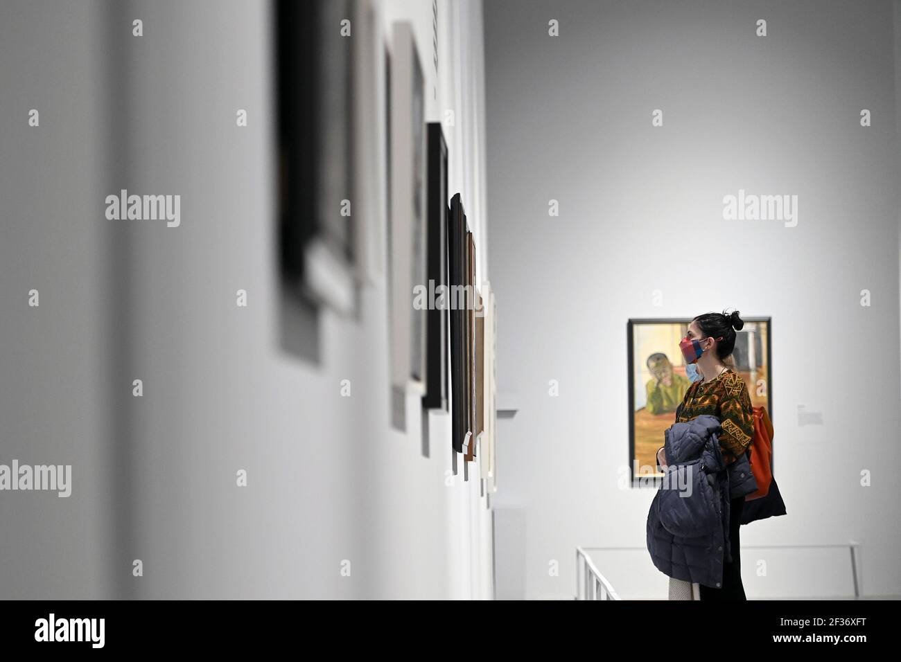 A woman attends the press preview of artist Alice Neel “People Come ...