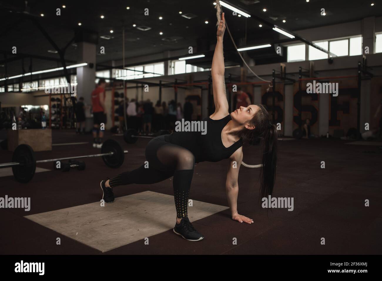 Female athlete stretching at functional training gym Stock Photo - Alamy