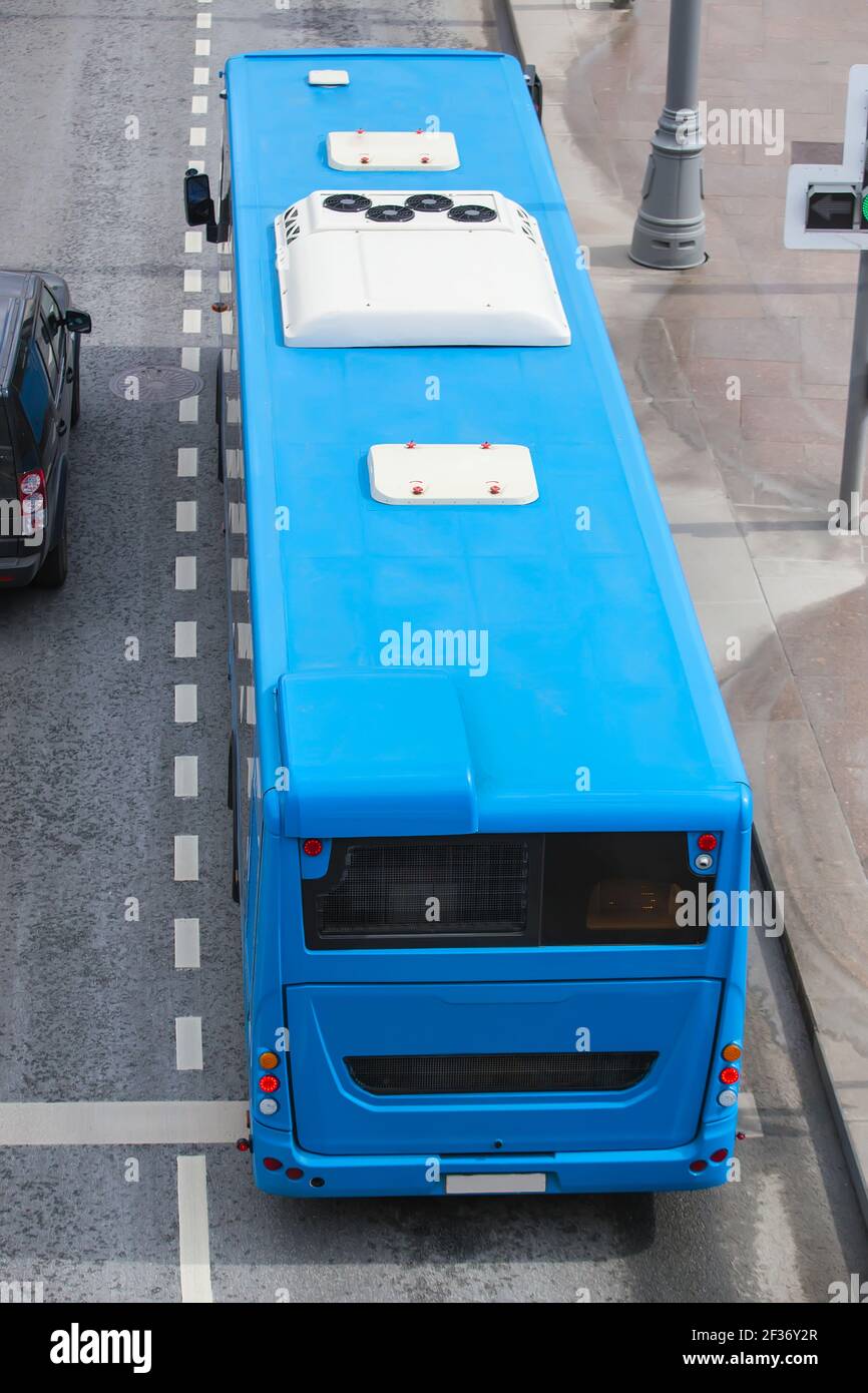 Blue city bus on moving road top view Stock Photo - Alamy