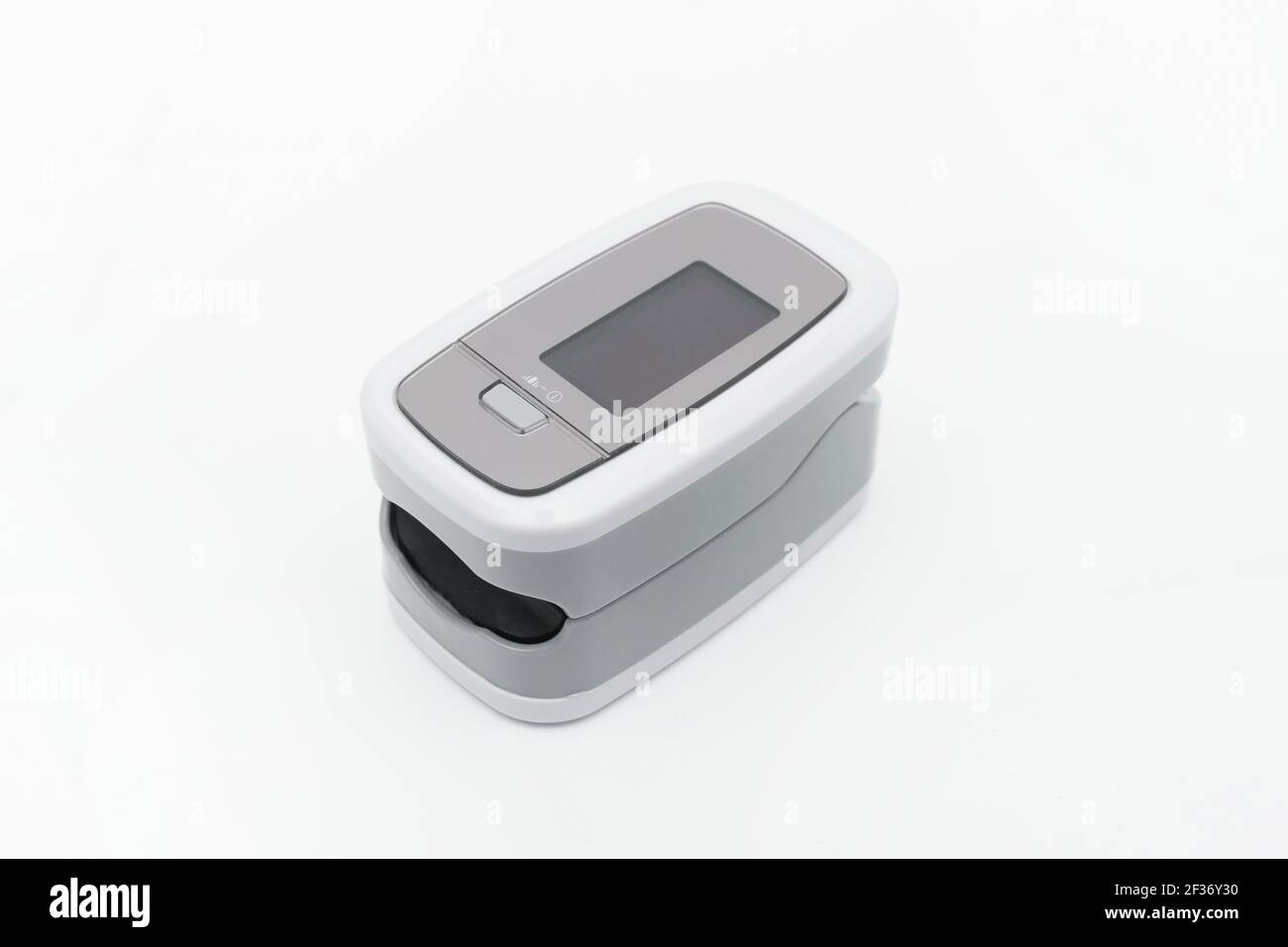 Modern medical fingertip pulse oximeter on white background, closeup ...