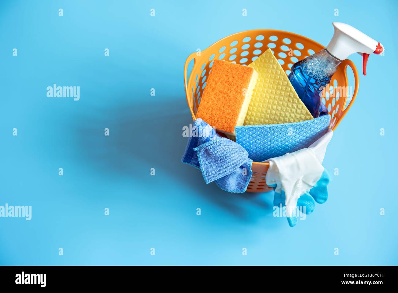 Colorful composition with sponges, rags, gloves and detergent for ...