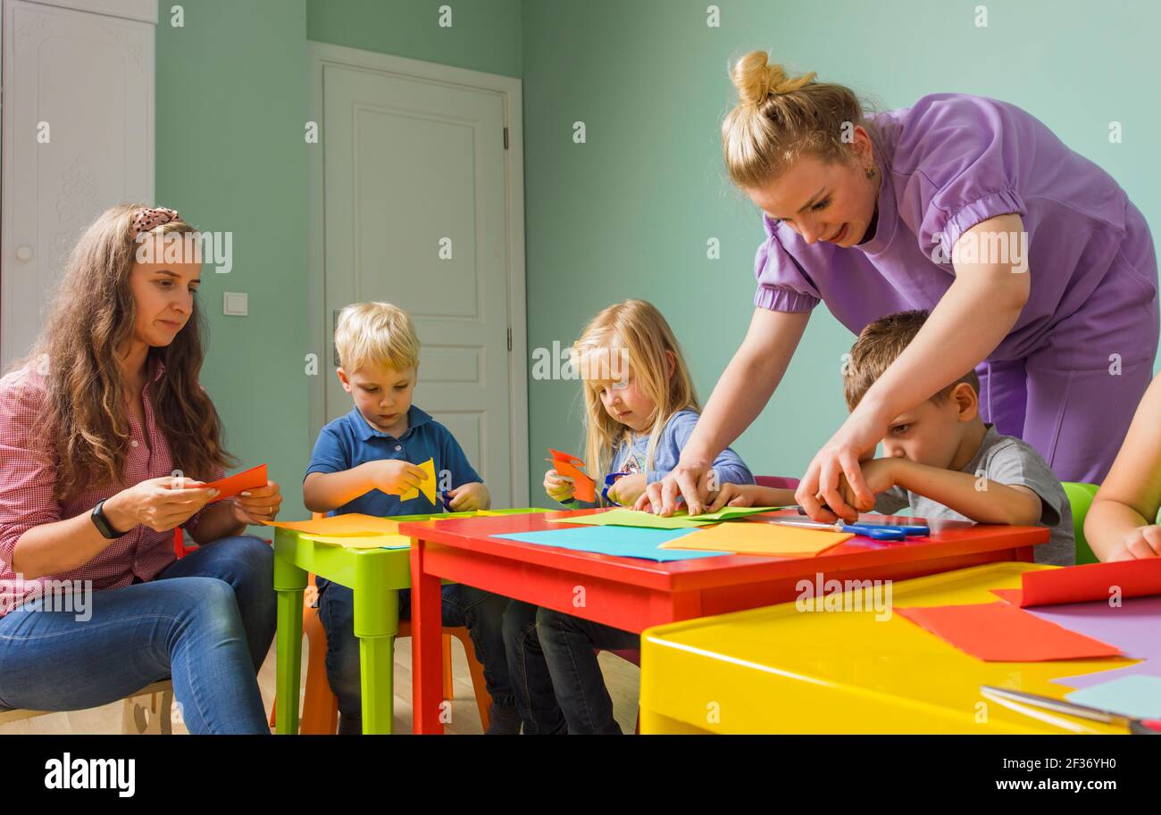 children and tutor study together at the creative school Stock Photo ...
