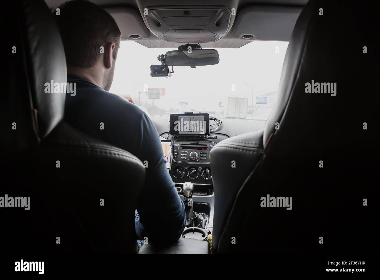 Driver in the car controls the navigator. Close-up part Stock Photo - Alamy