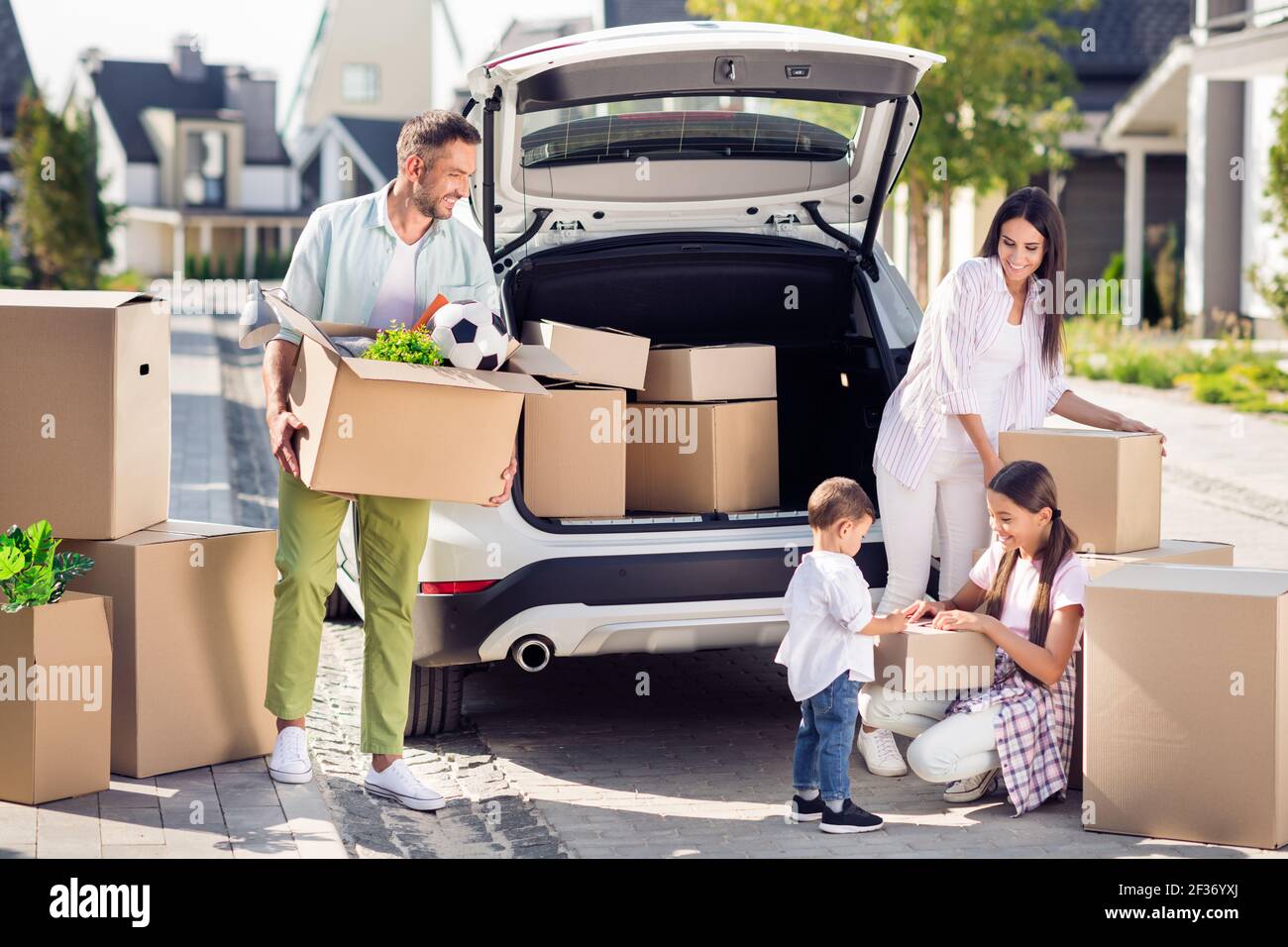 Full size photo of happy smiling cheerful family moving to new house ...