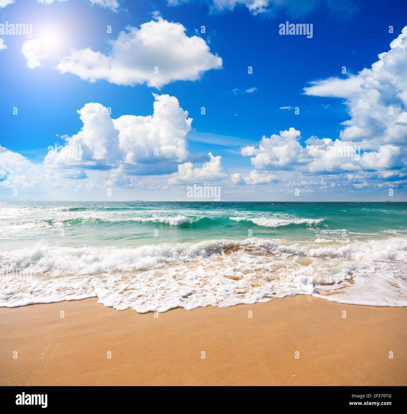 sandy beach and beautiful ocean waves Stock Photo - Alamy