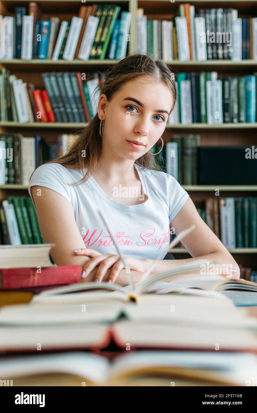 Back to school, reading book, education, library concept. Student girl ...