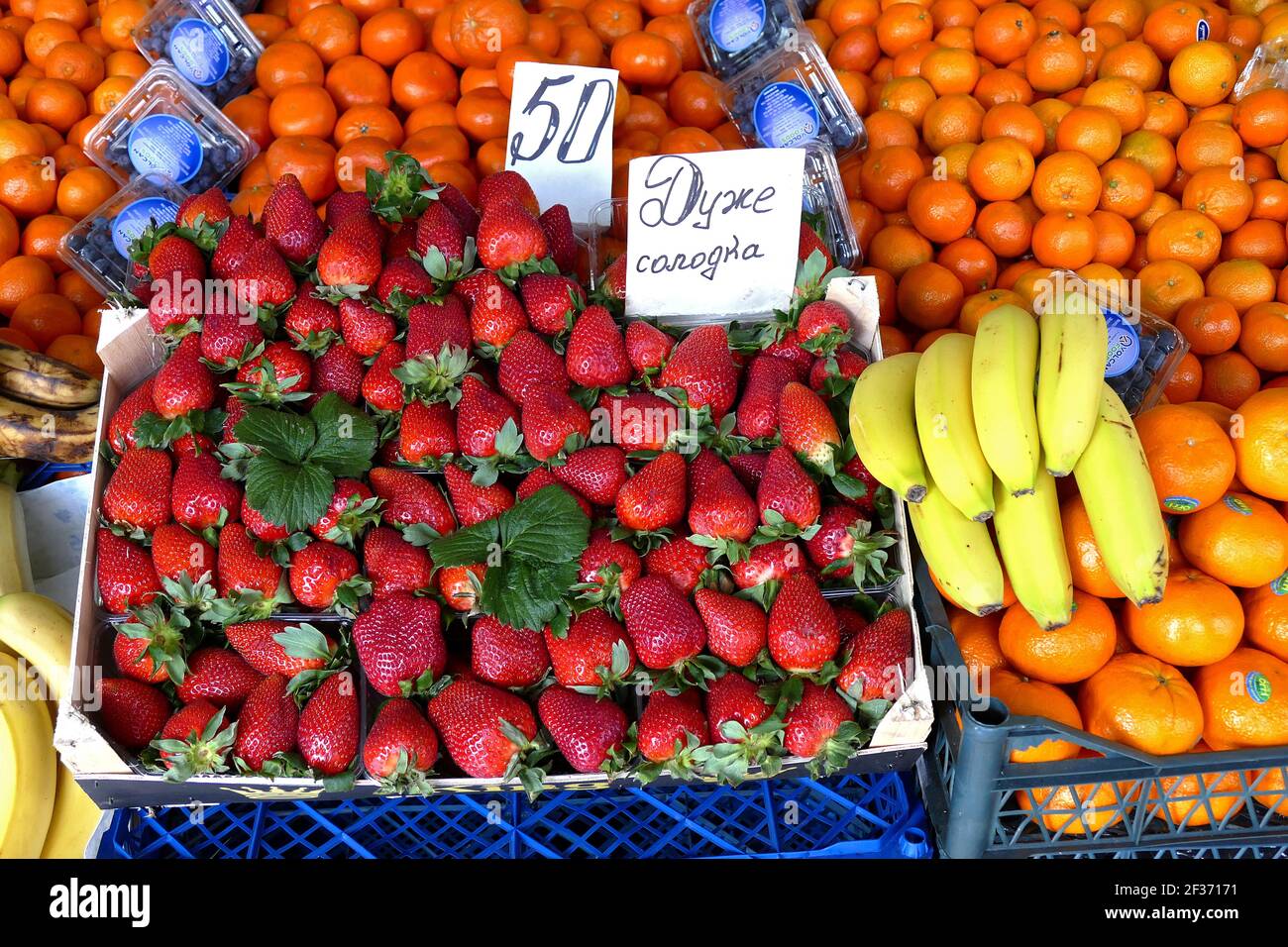 IVANO-FRANKIVSK, UKRAINE - MARCH 13, 2021 - Strawberries, tangerines ...