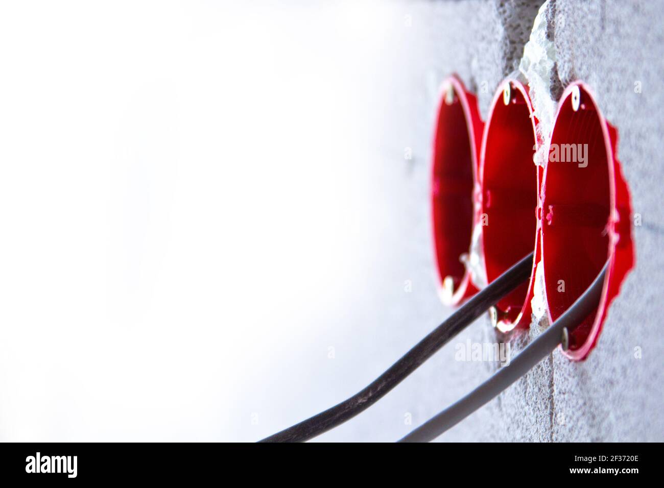 Socket boxes with wires in the wall. Cable routing background ...