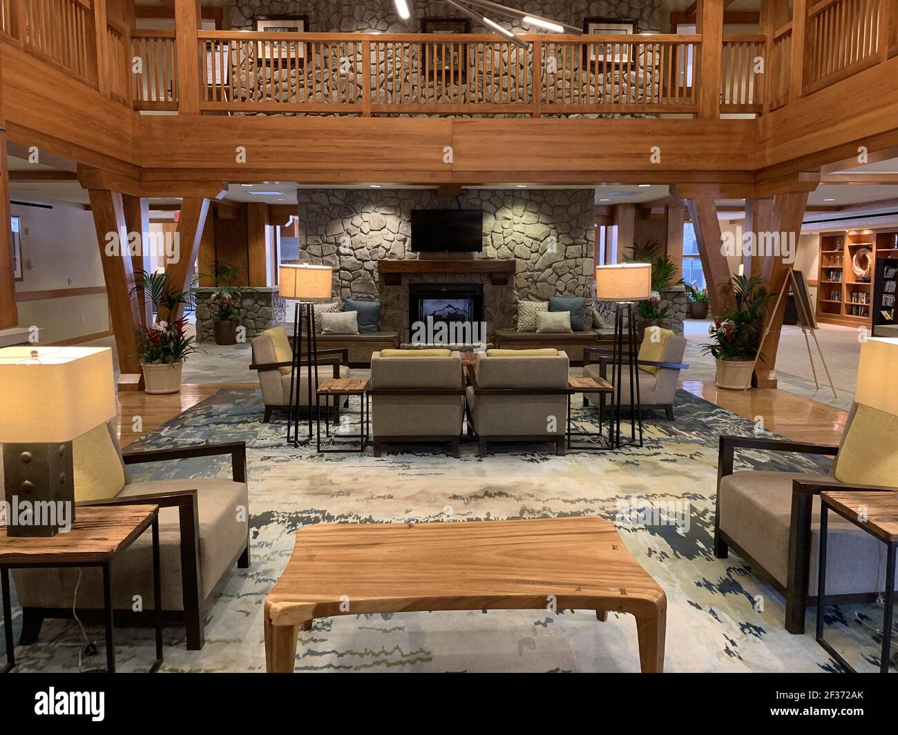 A modern interior of a cozy waiting room of a hotel with tables ...