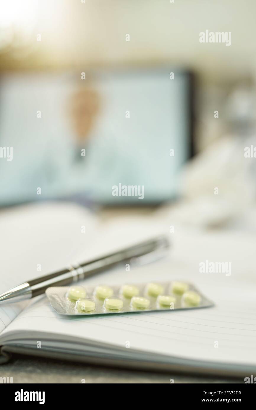Medication and pen for taking quick notes Stock Photo - Alamy