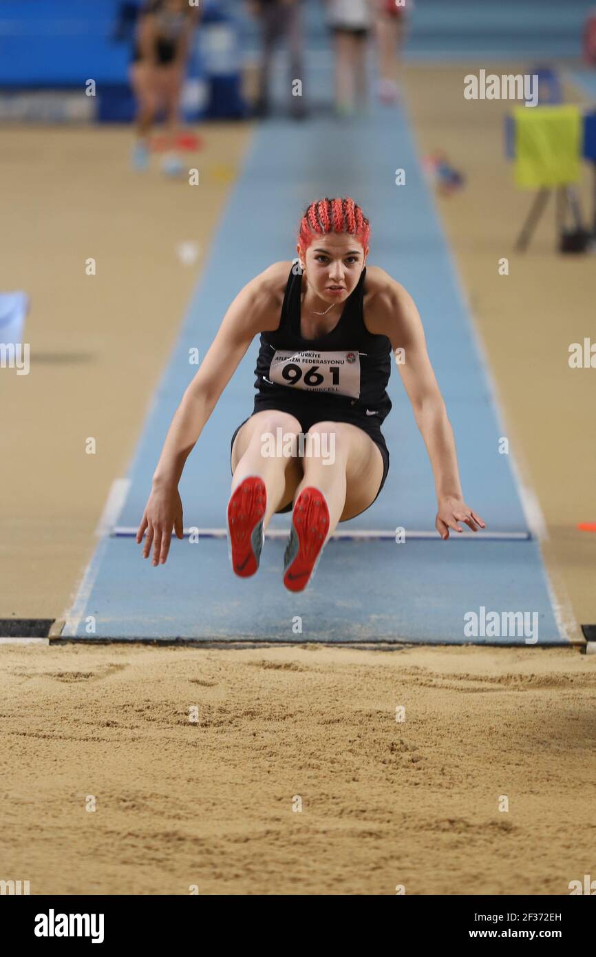 ISTANBUL, TURKEY - JANUARY 31, 2021: Undefined athlete long jumping ...