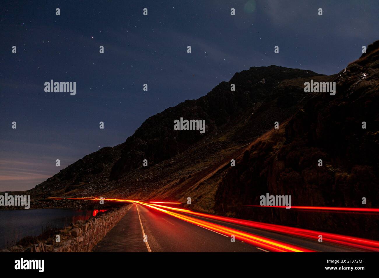 Traffic trails at night, Snowdonia, North Wales Stock Photo - Alamy