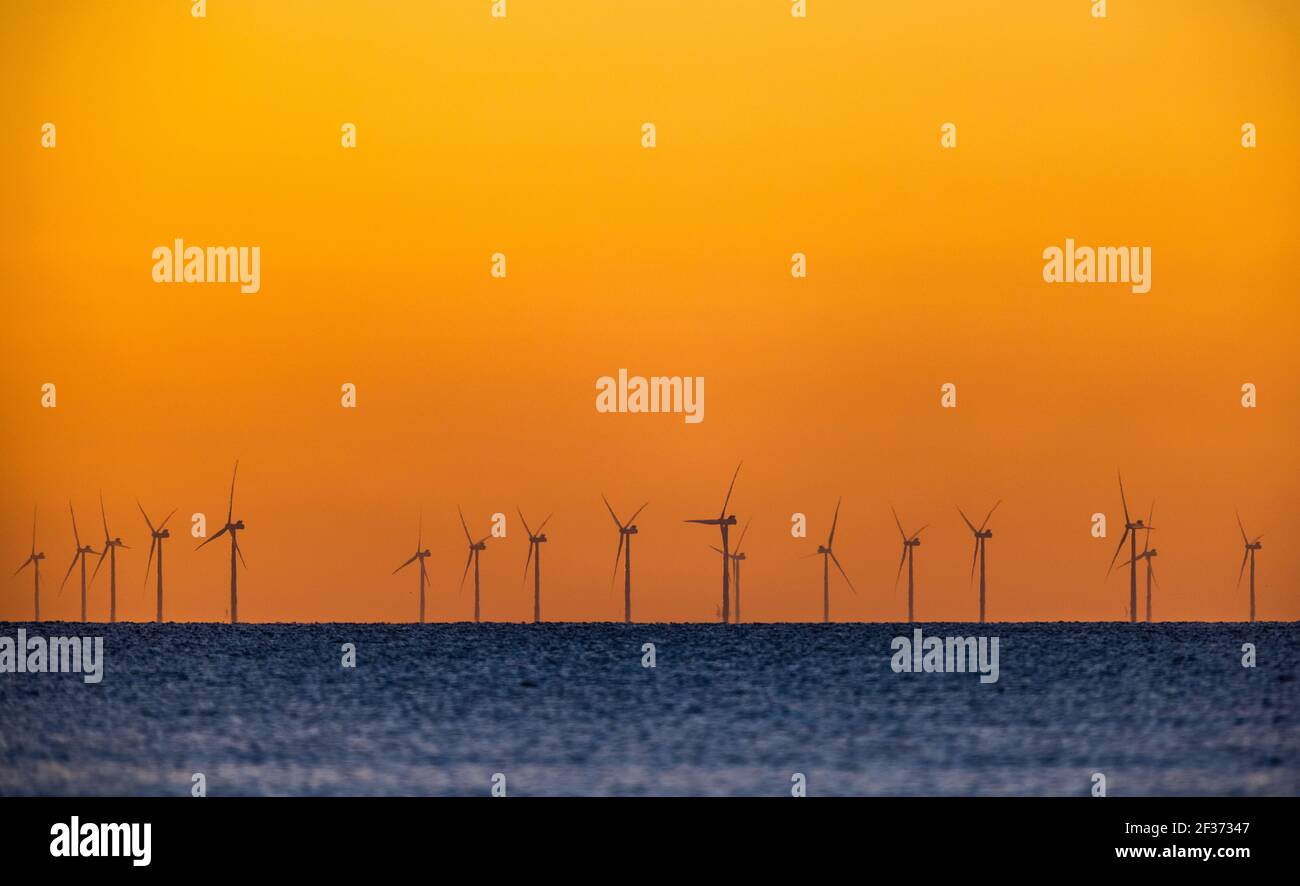 Rampion Offshore Wind farm at sunrise in Rustington in West Sussex ...