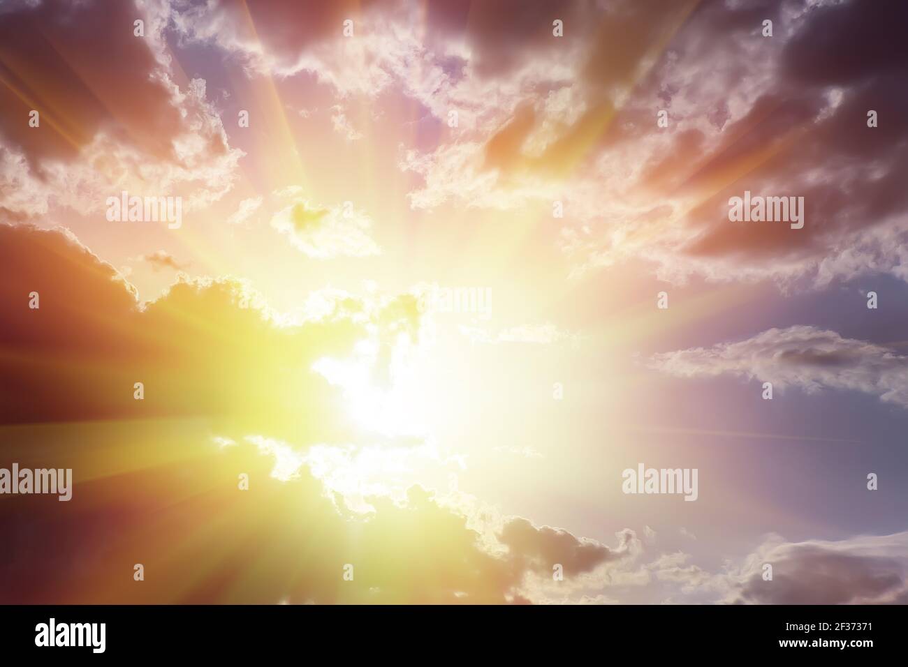 Sun rays look through dark cirrus clouds Stock Photo - Alamy